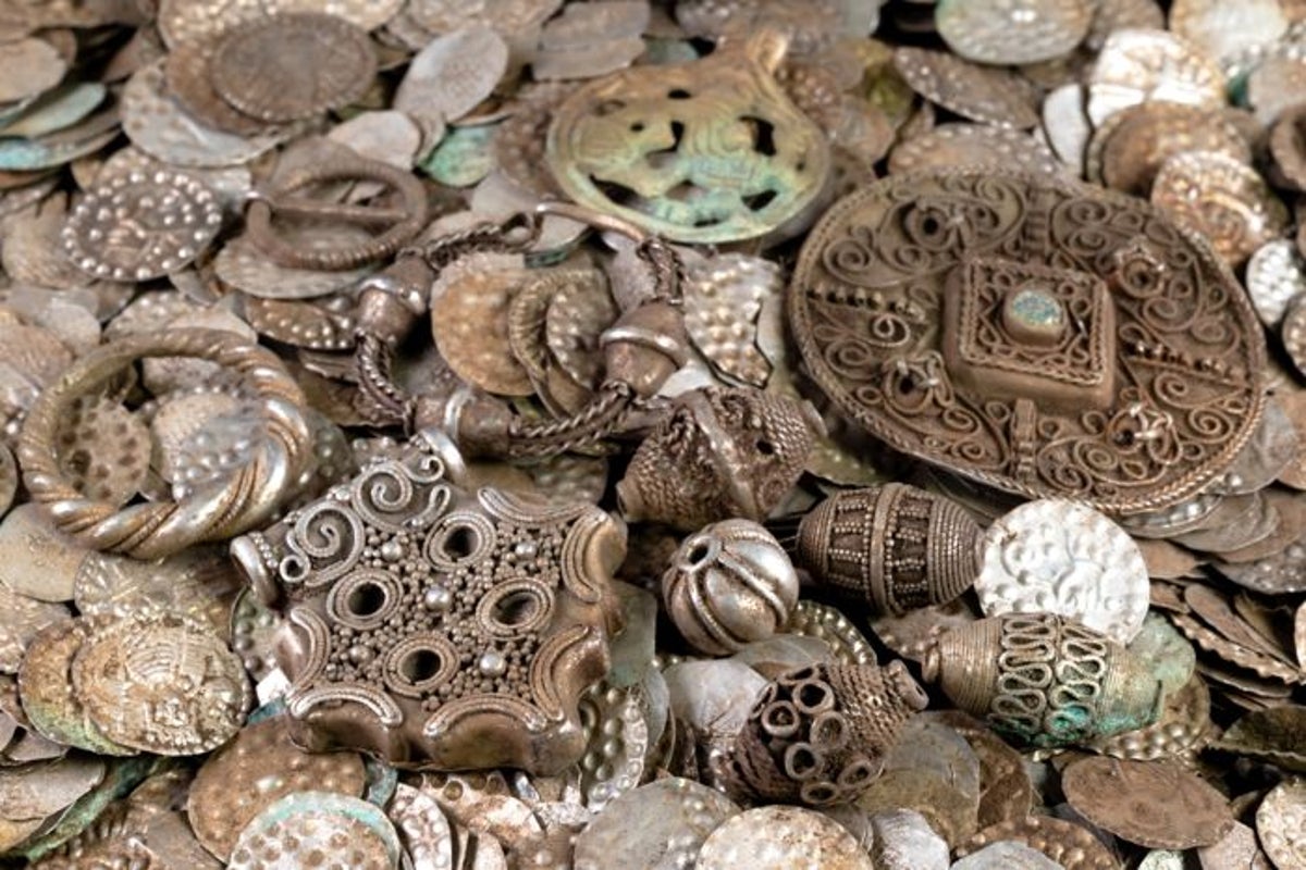 Angler digging for worms uncovers medieval cauldron filled with coins ...