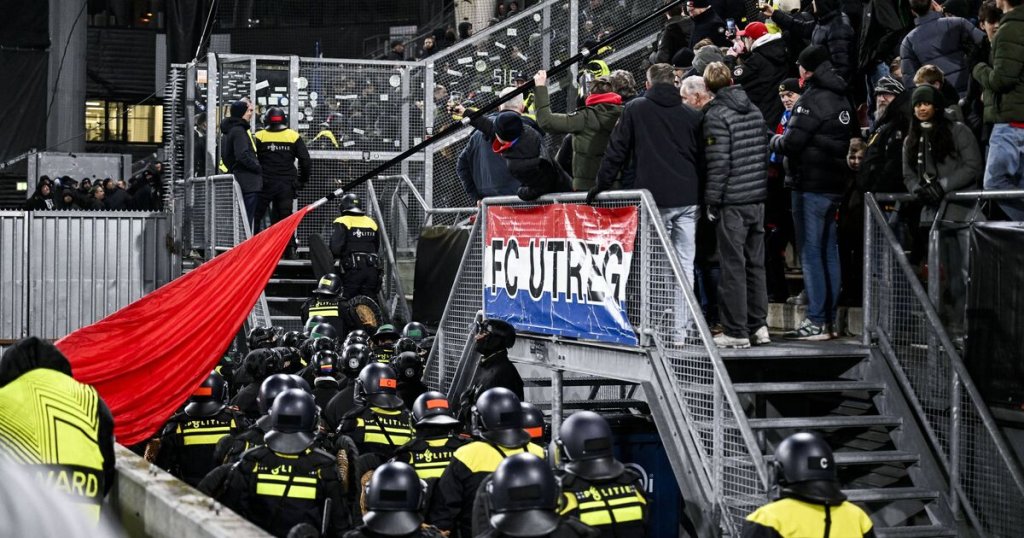 Europa League match delayed as riot police storm crowd and 1,400 fans ...